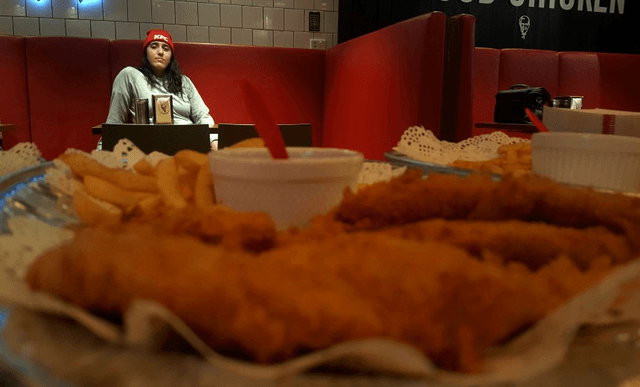 A KFC fangirl attends the opening of the fancy new KFC | The Spinoff